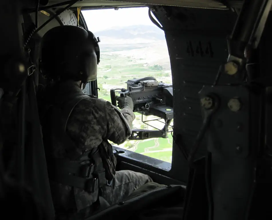 Military Photos Manning the Door Gun
